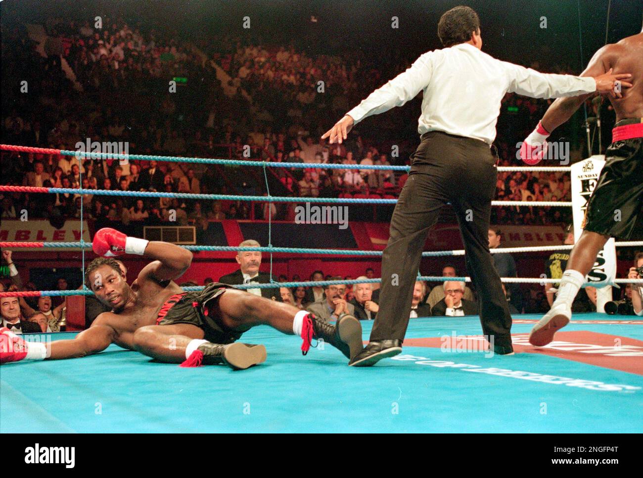 Britain's Lennox Lewis is down on the canvas after losing his World ...
