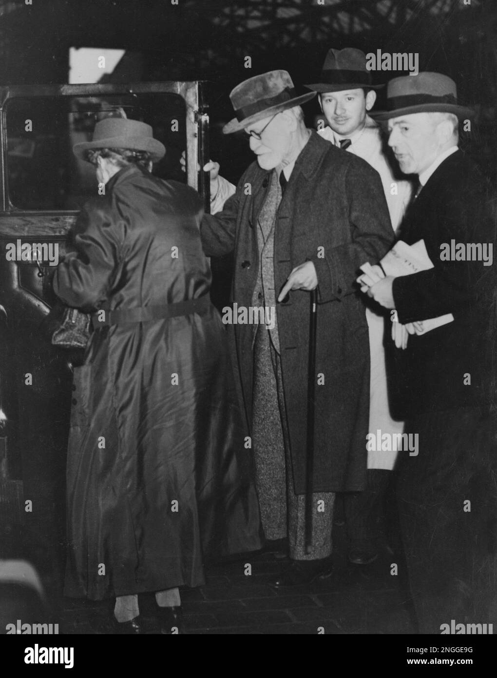 Prof. Sigmund Freud, holding cane, is shown after arriving at Victoria ...