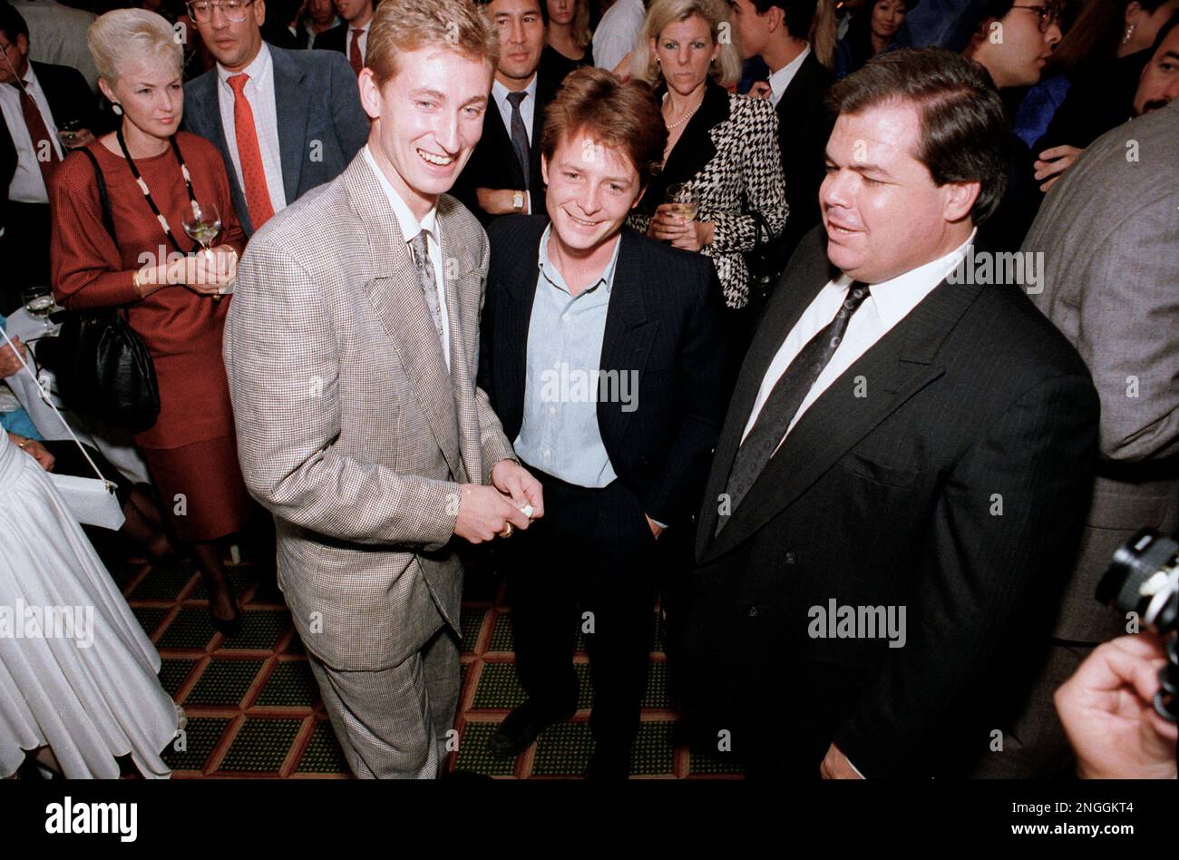 Wayne Gretzky, left, of the Los Angeles Kings, actor Michael J. Fox ...