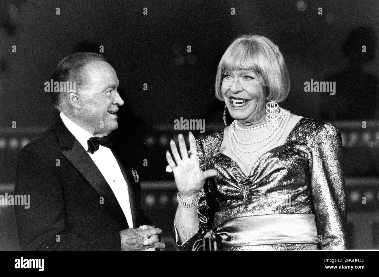 Milton Berle, dressed in drag, performs a skit with Bob Hope during ...