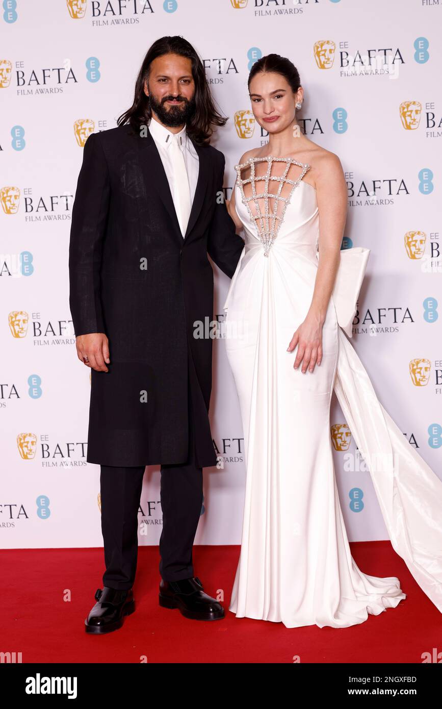 Shazad Latif, left, and Lily James pose for photographers at the 76th ...
