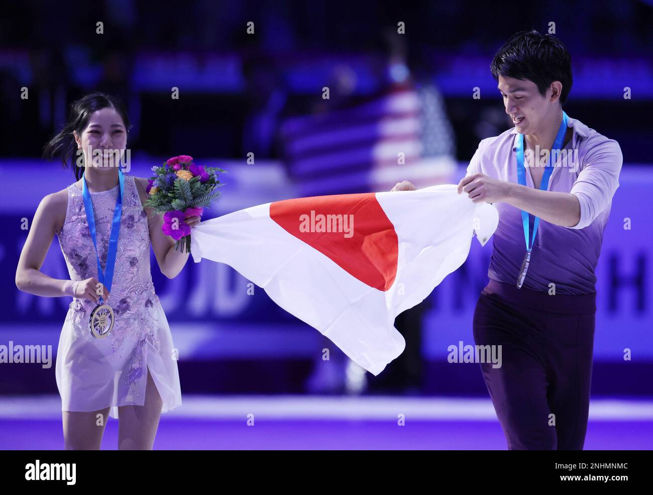 Riku Miura and Ryuichi Kihara of Japan celebrate during an award ceremony of pairs in ISU Grand ...