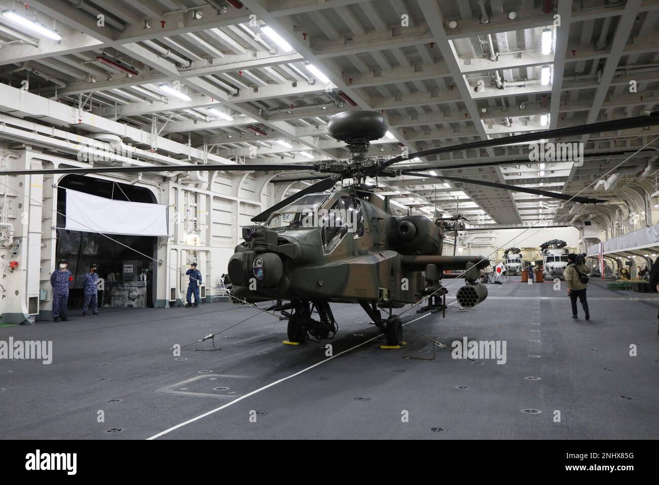 An AH-47 helicopter of Japan Maritime Self-Defense Forces is stored on ...