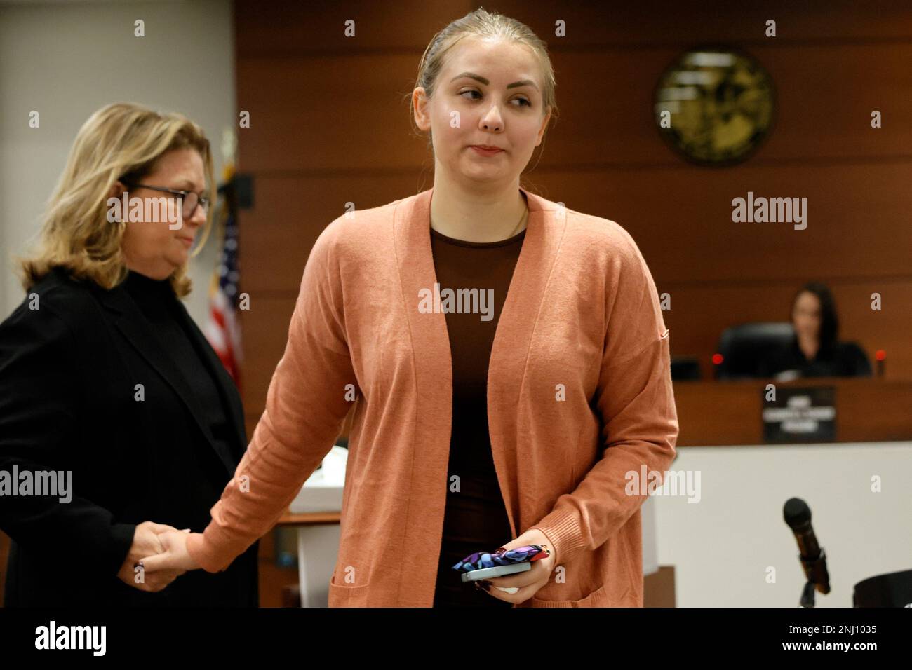 Assistant State Attorney Carolyn McCann, left, squeezes Meghan Petty's ...