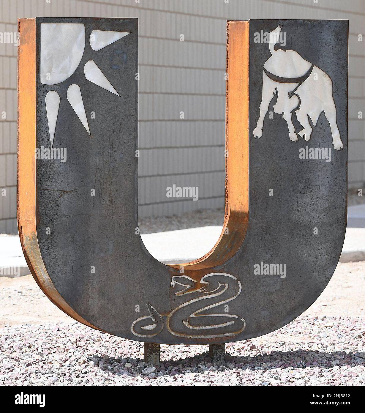 Three features are shown in the "U" in the new "UMA" sign on the ...