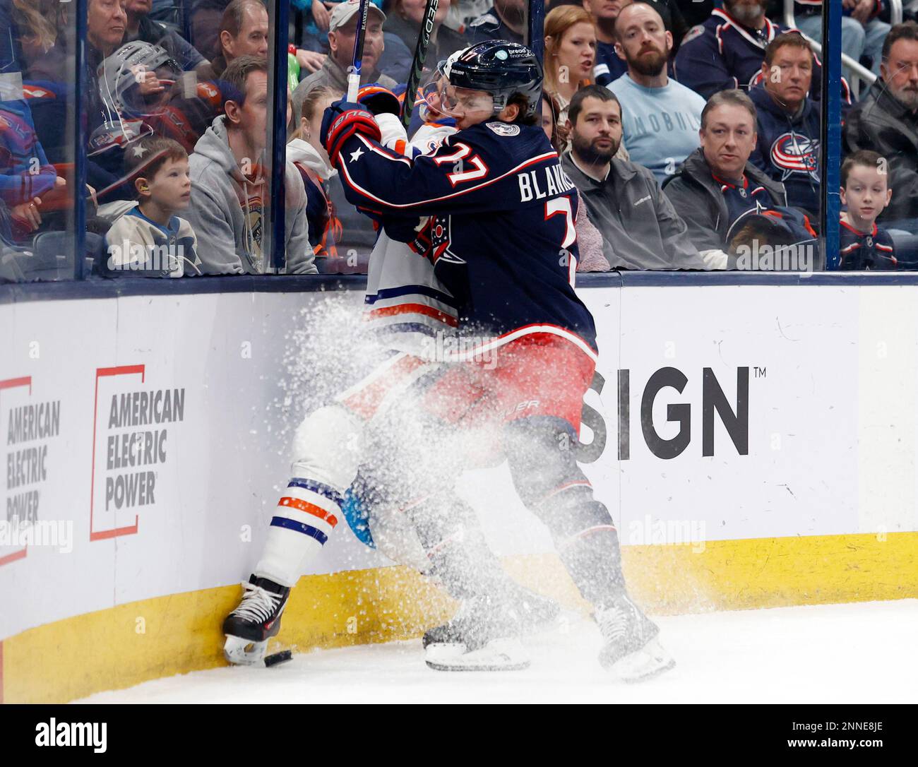 Columbus Blue Jackets defenseman Nick Blankenburg, right, checks ...