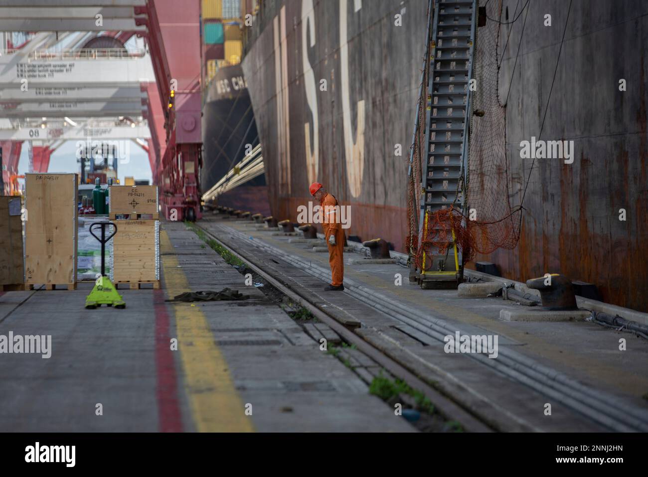 An operator unloads cargo containers at the unloading dock at the Port ...