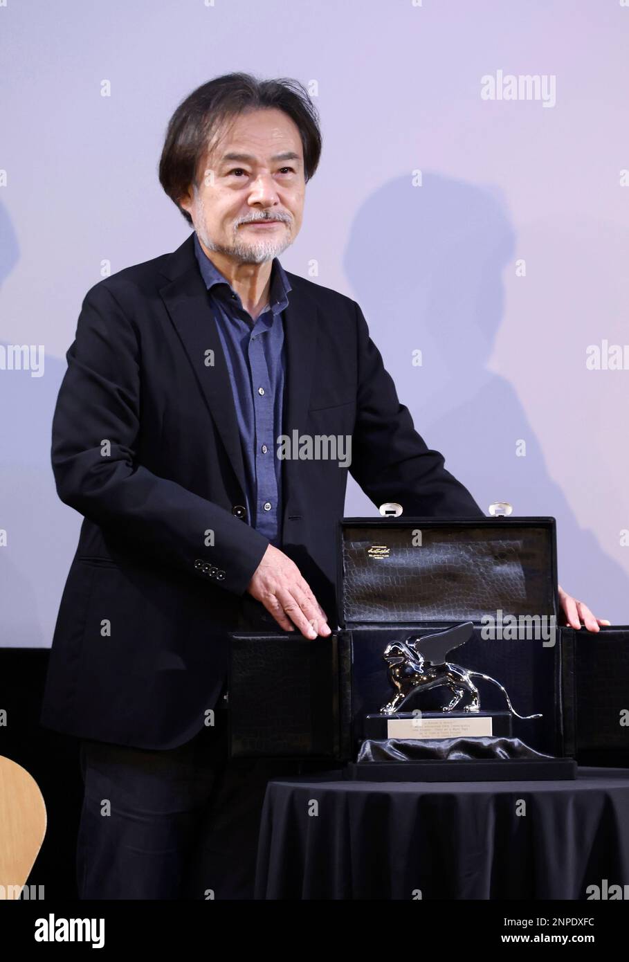 Film director Kiyoshi Kurosawa poses with the Silver Lion trophy, the ...
