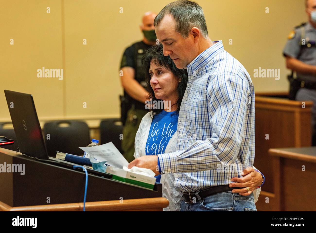 Brian Cope, right, accompanied by his wife Teresa, speak about the loss ...