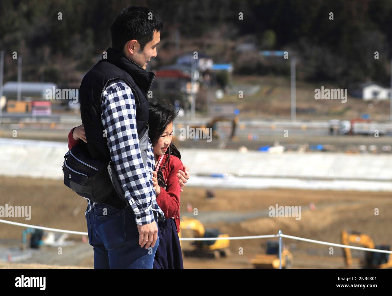 A father and his daughter visit the Minamisanriku disaster prevention ...