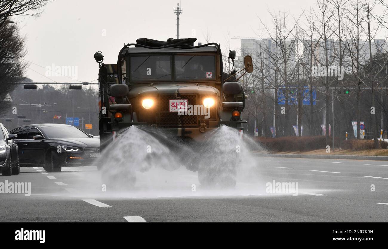 In this Feb. 11, 2020 photo, Soldiers in the military truck, spray ...