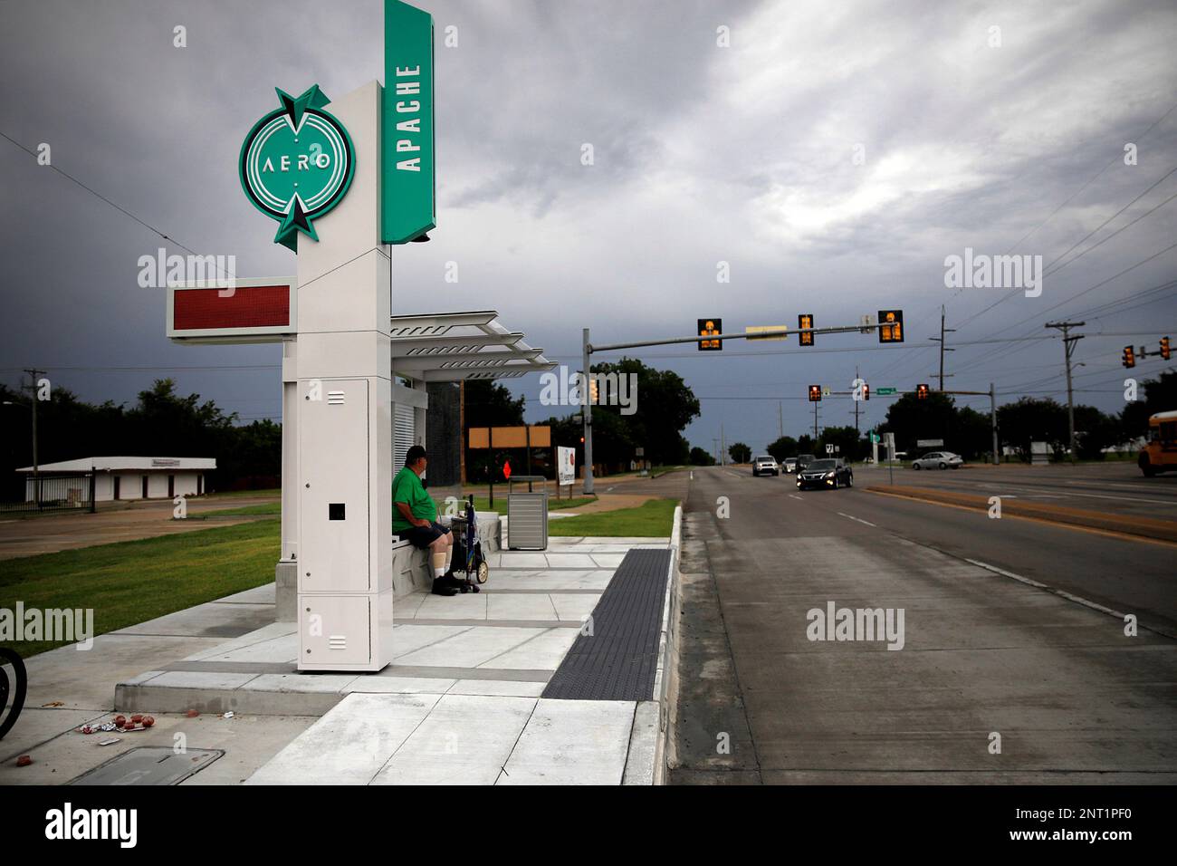 In this Thursday, Aug. 22, 2019, photo, Johnie Gillihan waits for a bus ...