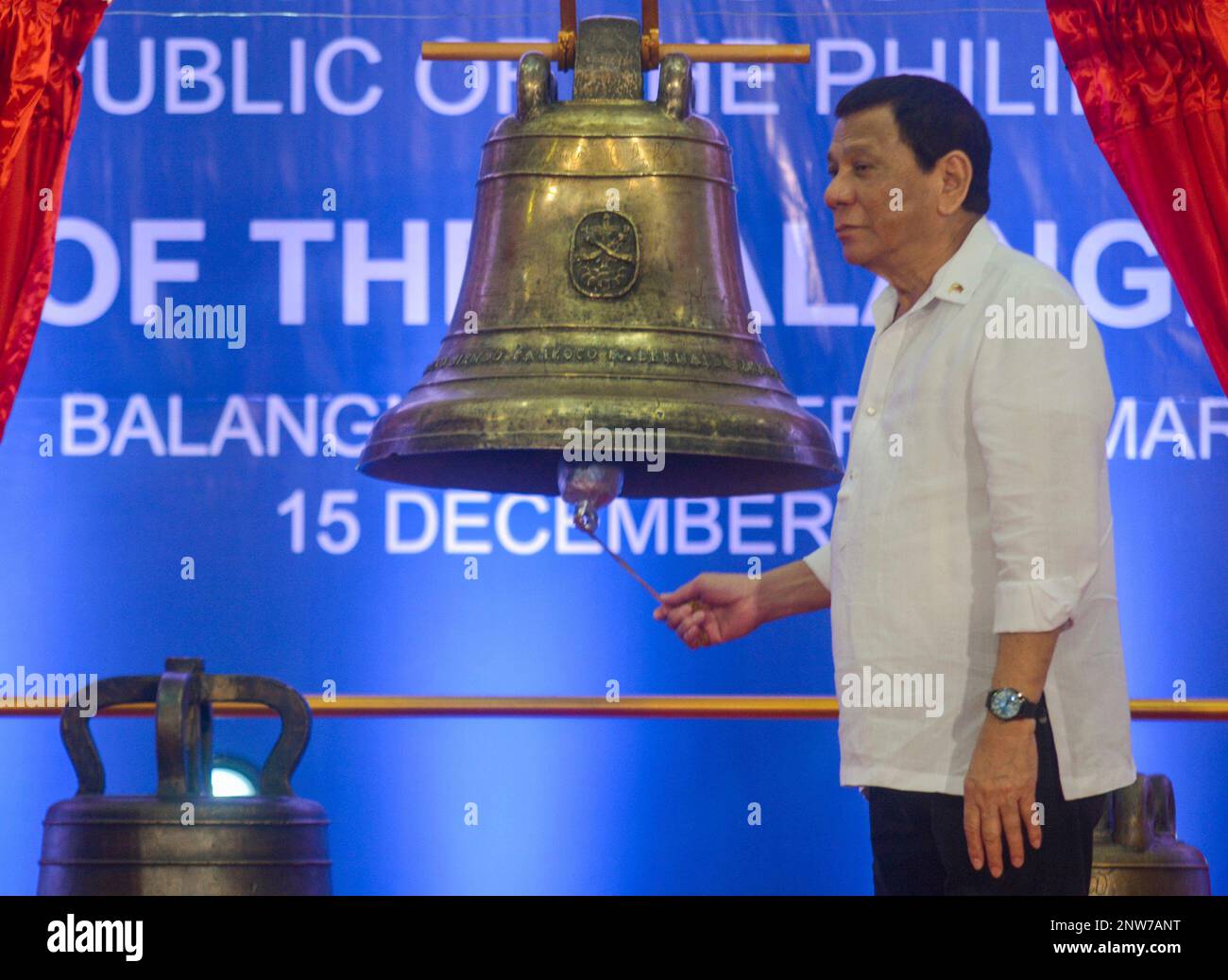 Philippine President Rodrigo Duterte makes a ceremonial tolling of one ...