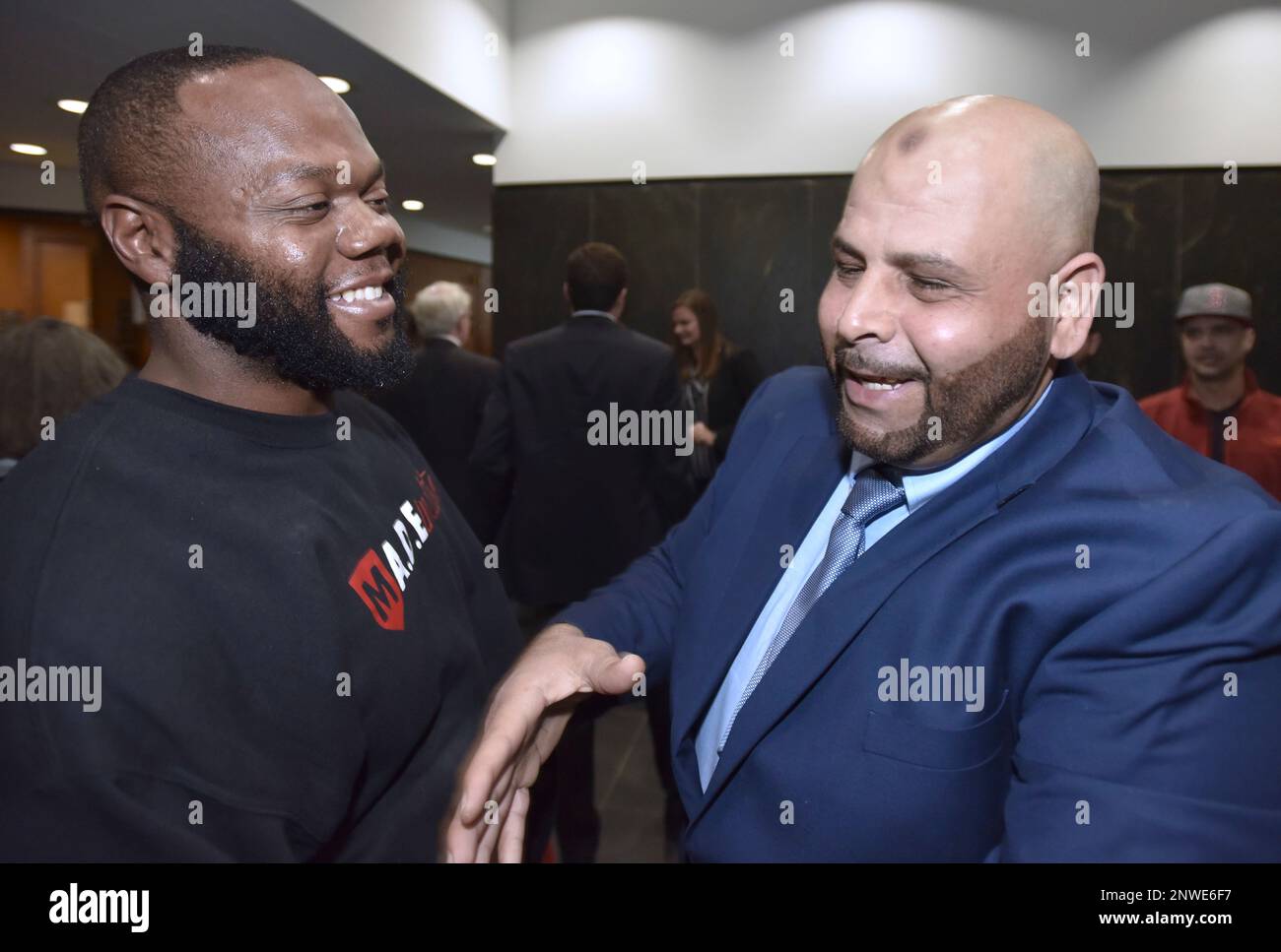 Mubarez Ahmed, right, hugs friend Leon El-Alamin after the hearing ...