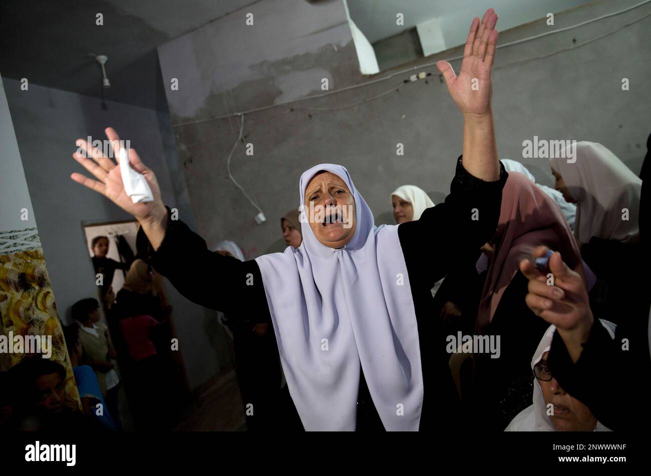 CORRECTS DATE TO AUG 4 - Palestinian relatives of Moaath al-Souri, who ...
