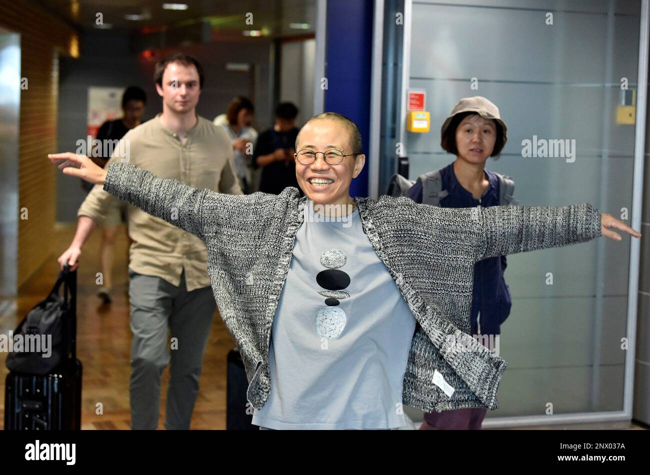 Liu Xia, the widow of Chinese Nobel dissident Liu Xiaobo, gestures she arrives at the Helsinki ...