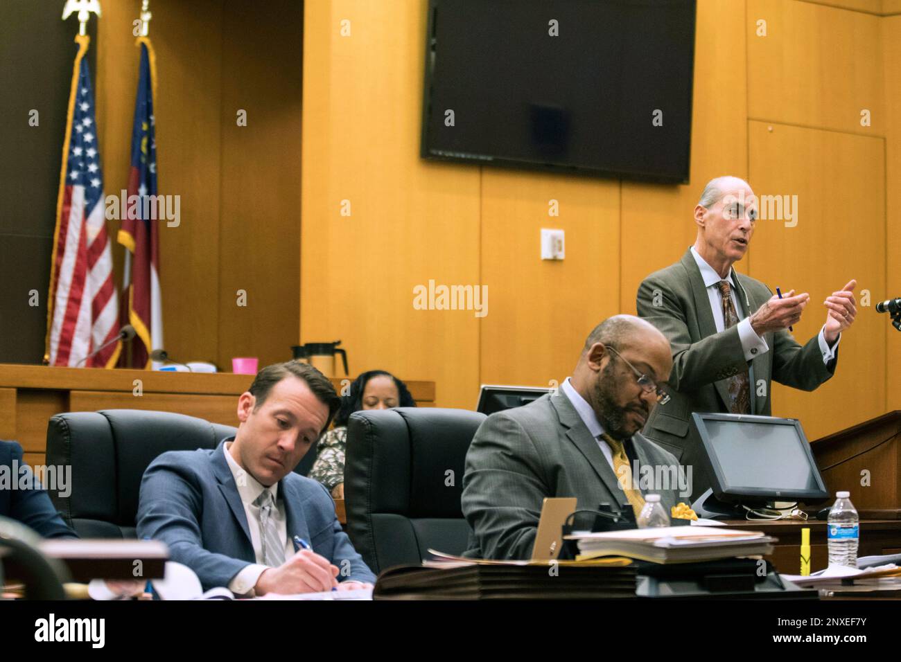 Defense Attorney Bruce Harvey, right, questions a potential juror ...