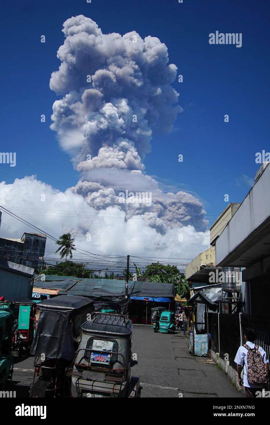 A huge column of ash shoots up to the sky during the eruption of Mayon ...