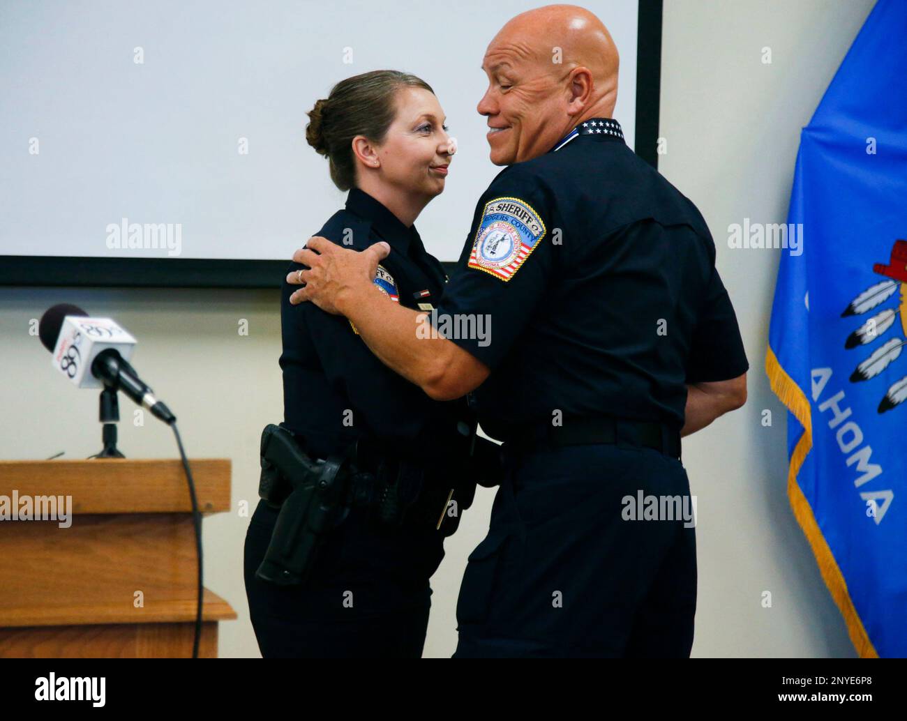 Rogers County Sheriff Scott Walton shakes hands with former Tulsa police officer Betty Shelby ...
