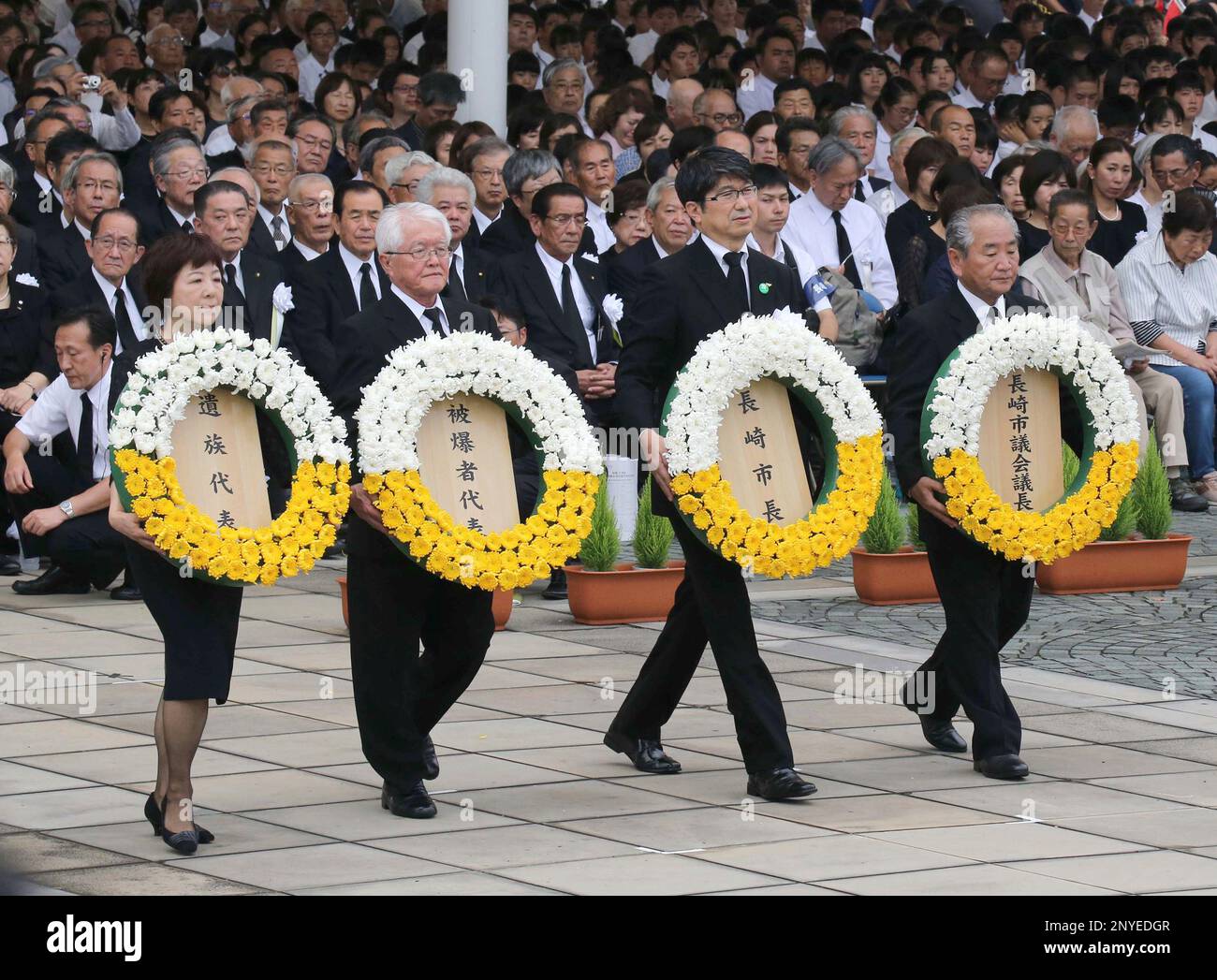 Tomihisa Tanoue (2nd from R), mayor of Nagasaki, representatives of ...