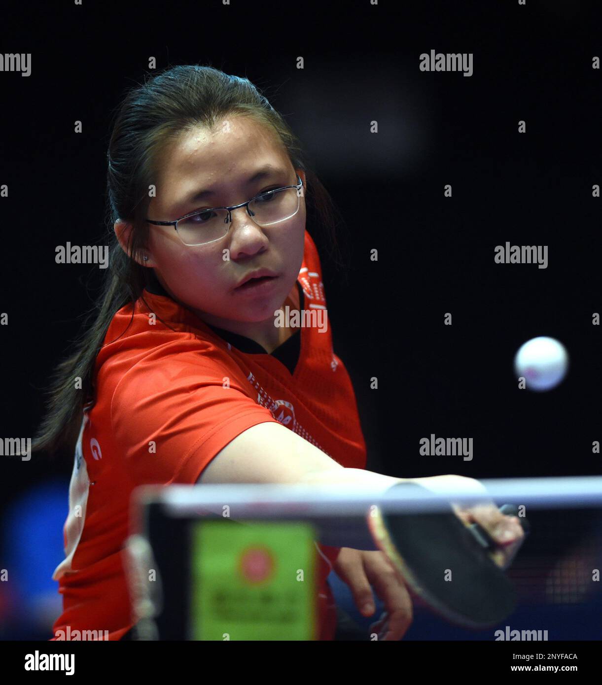 Lee Ka Yee of Hong Kong returns a shot as she and Ng Wing Lam compete against Ojio Haruna and ...