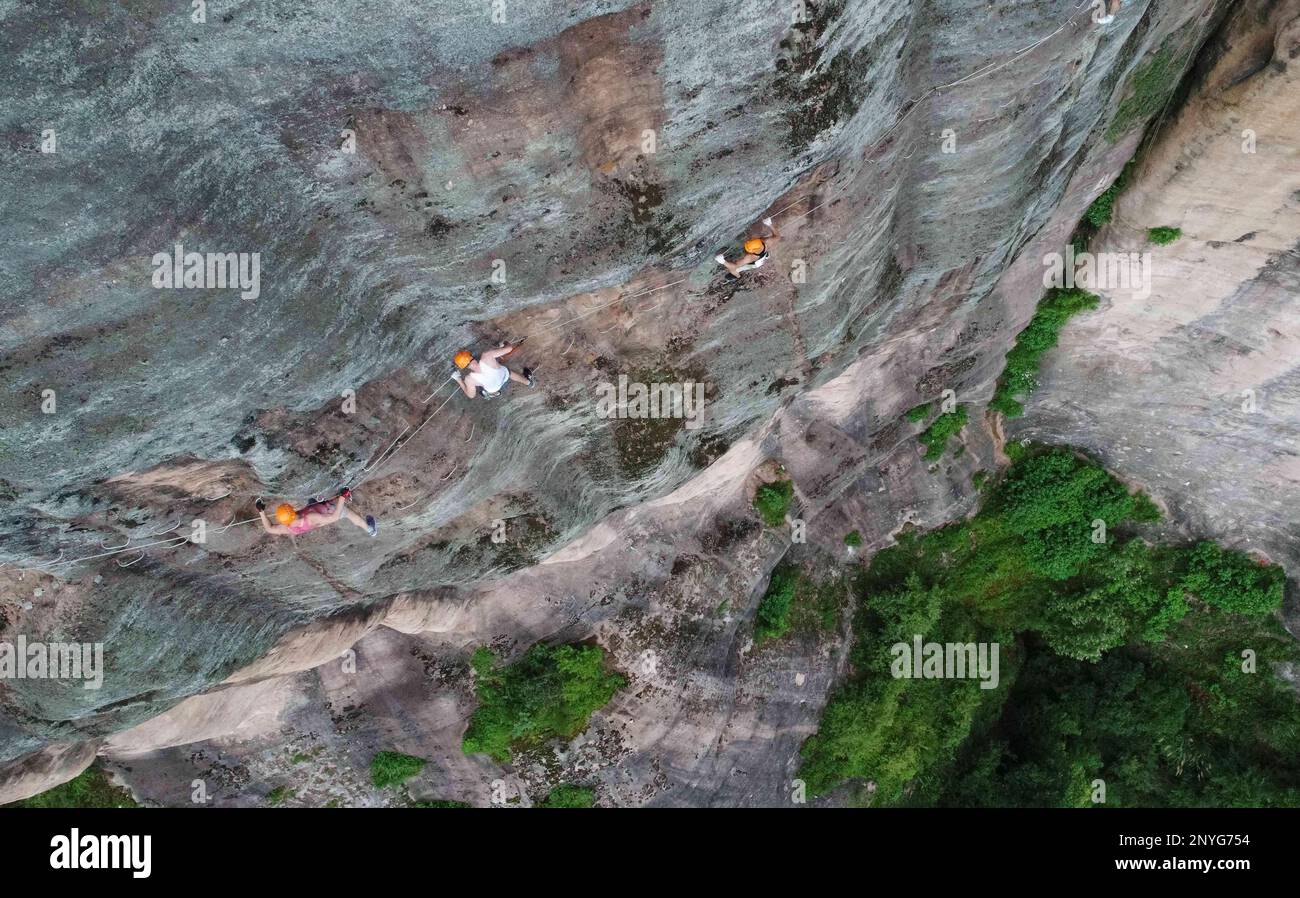 Participants compete in a via ferrata at Shiniuzhai National Geological ...