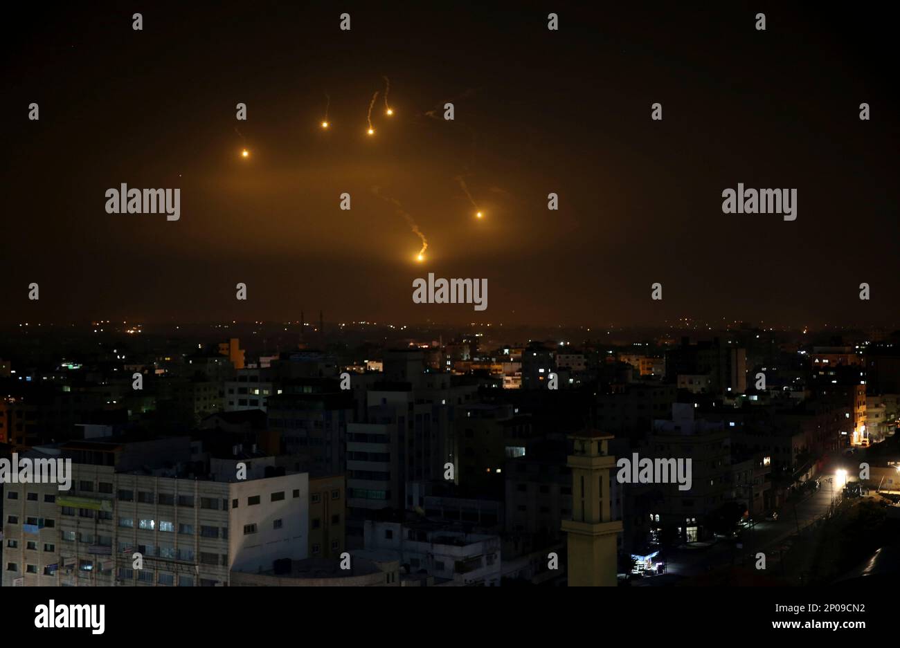Israeli forces' flares light up the night sky of Gaza City, Monday, Feb ...