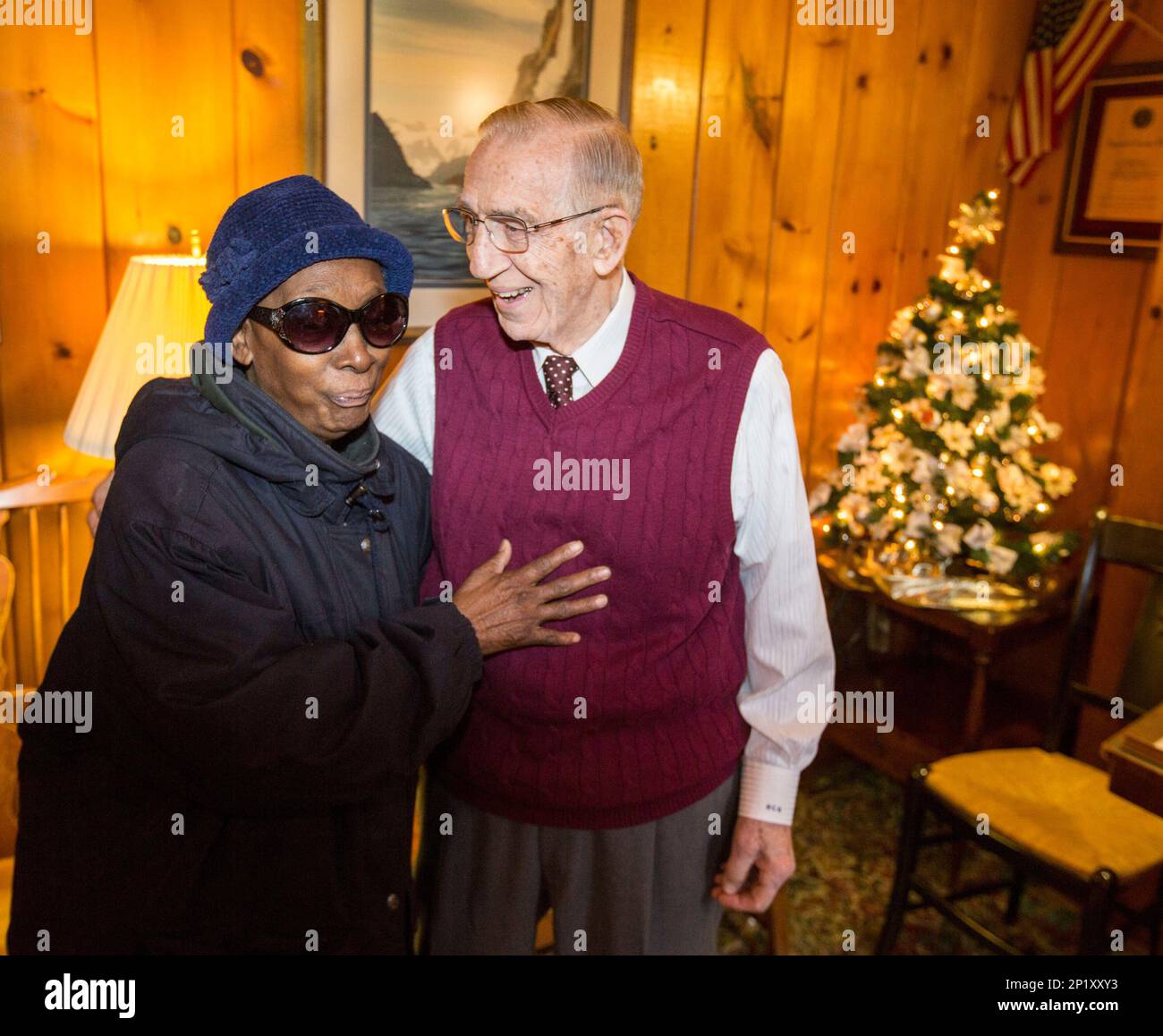 Dr. Raymond Grandon, 96, gets a hug from Geneva Blandine, 83, on his ...