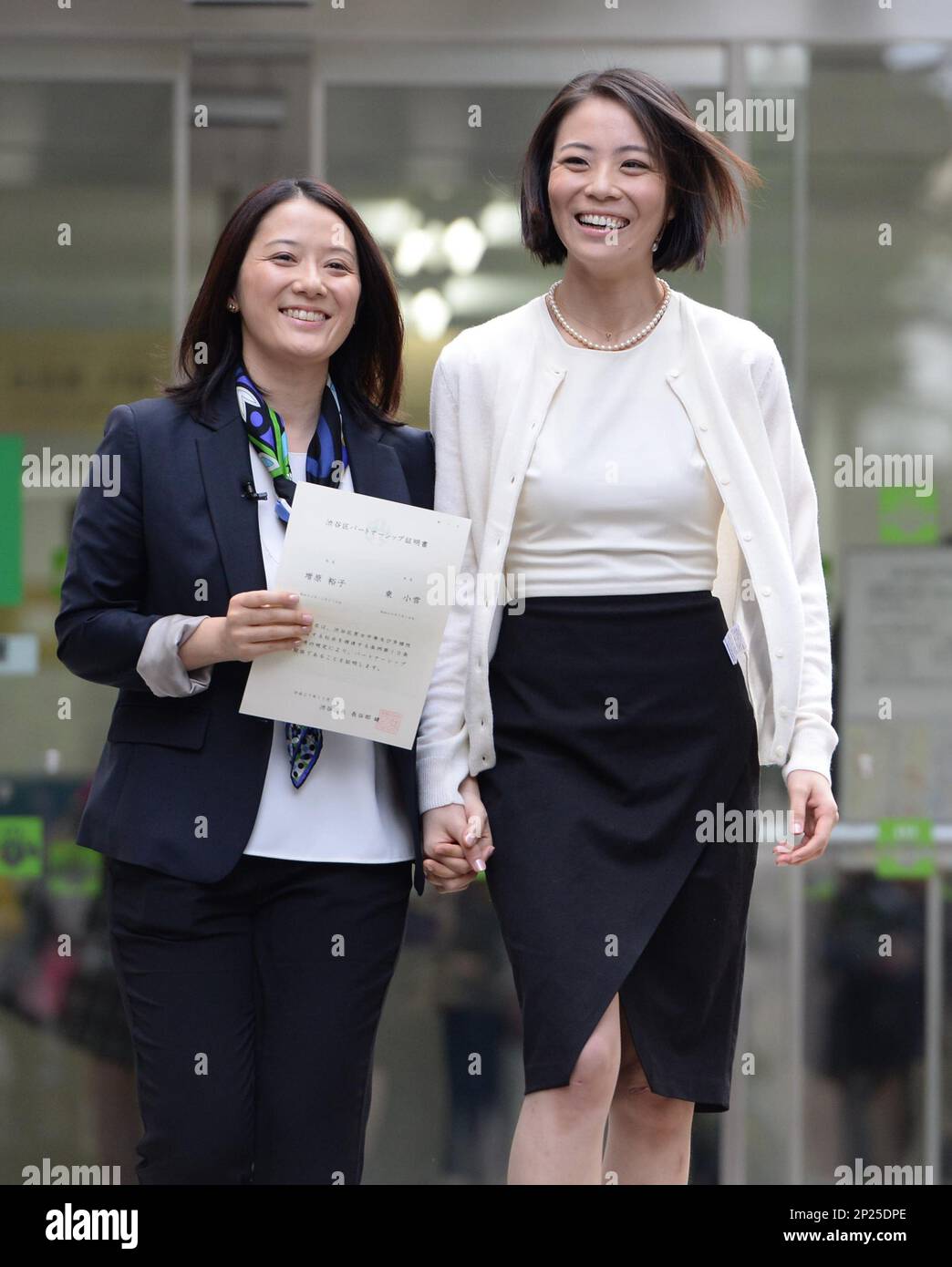 Koyuki Higashi (R) and Hiroko Masuhara smile after they received a ...