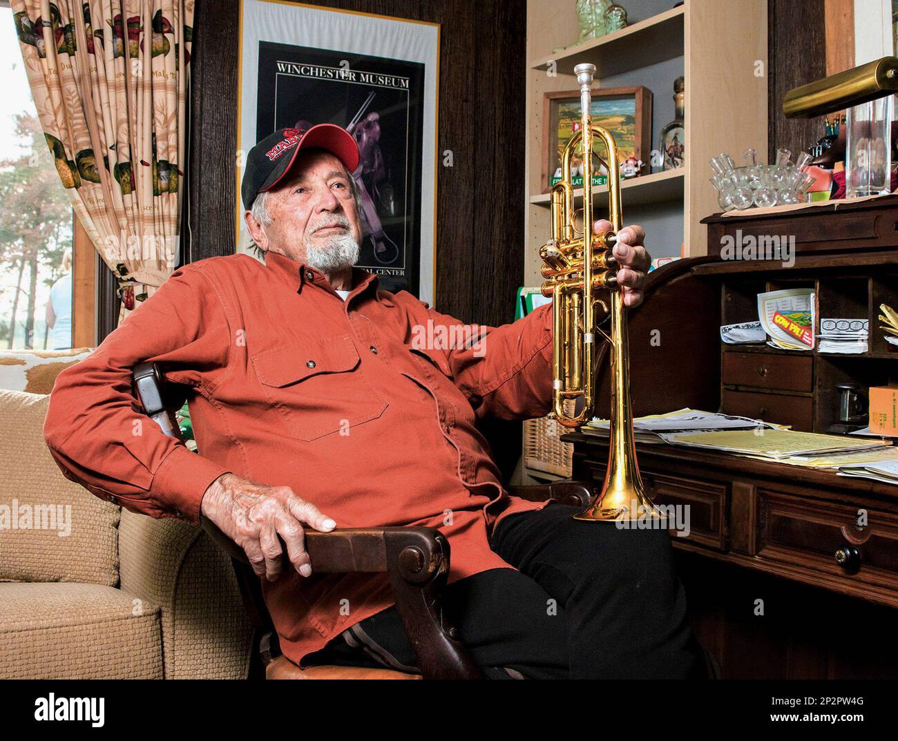 In this photo taken May 16, 2015, Ted Fredenhagen holds his trumpet as ...