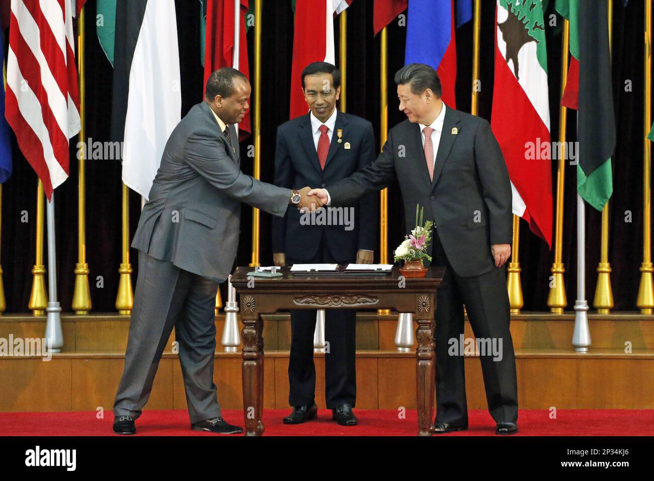 Swaziland's King Mswati III, left, shakes hands with Chinese President ...