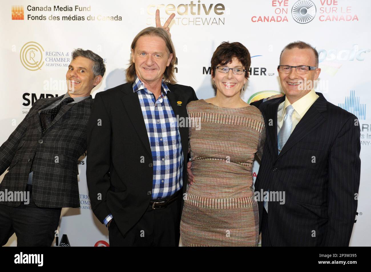 Fred Ewanuick, from left, photobombs director David Storey, executive producer Virginia Thompson ...