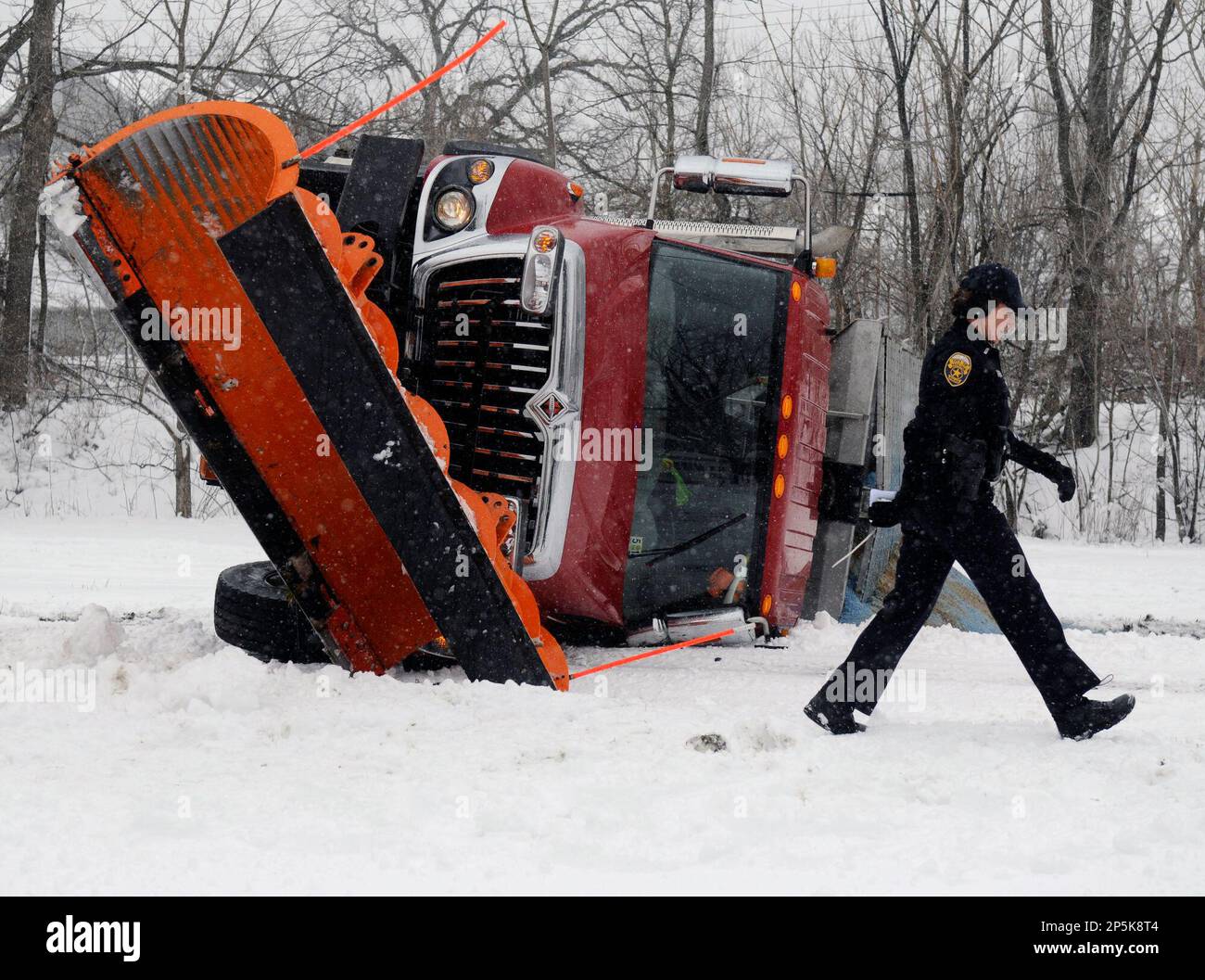 Moline Ill. police officer Michelle Mangelsdorf investigates a rollover ...