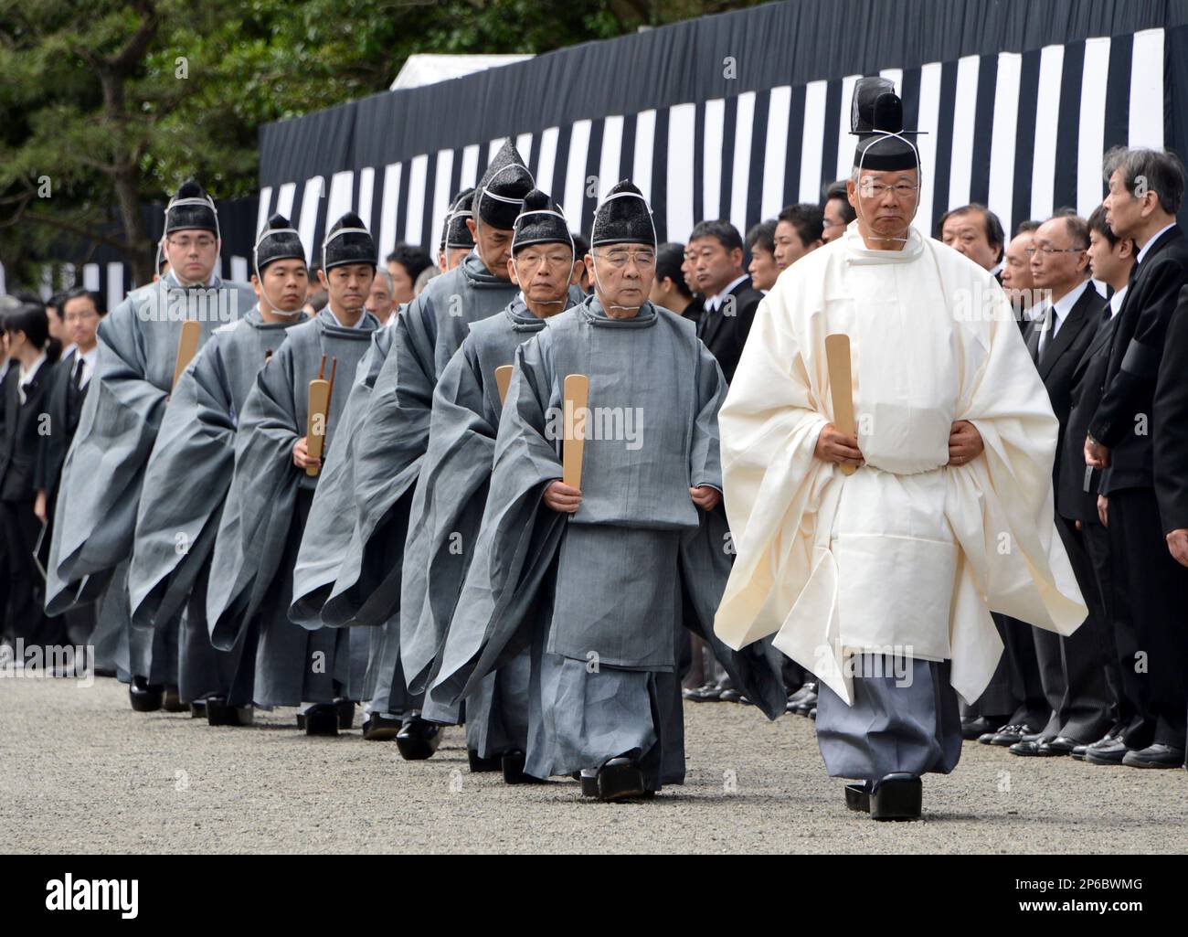Shinto priests walk during a funeral for the late Prince Tomohito, a ...