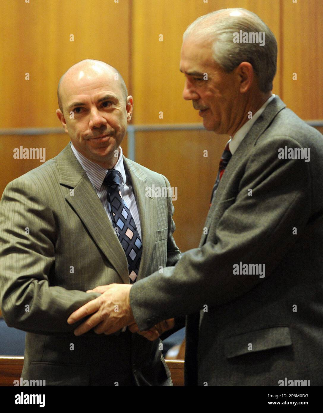 Tina Watson's father, Tommy Thomas, right, greets dive master Wade ...