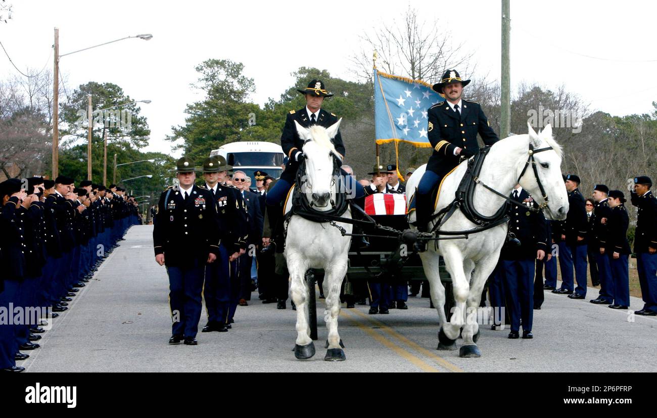 Soldiers line the route of the caisson procession in Fort Jackson, for ...