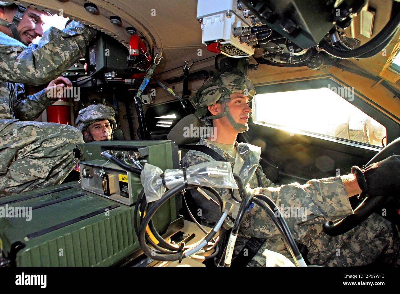 It is a tight fit for PFC Benjamin Morrison, driving, PFC Michael Mindt ...