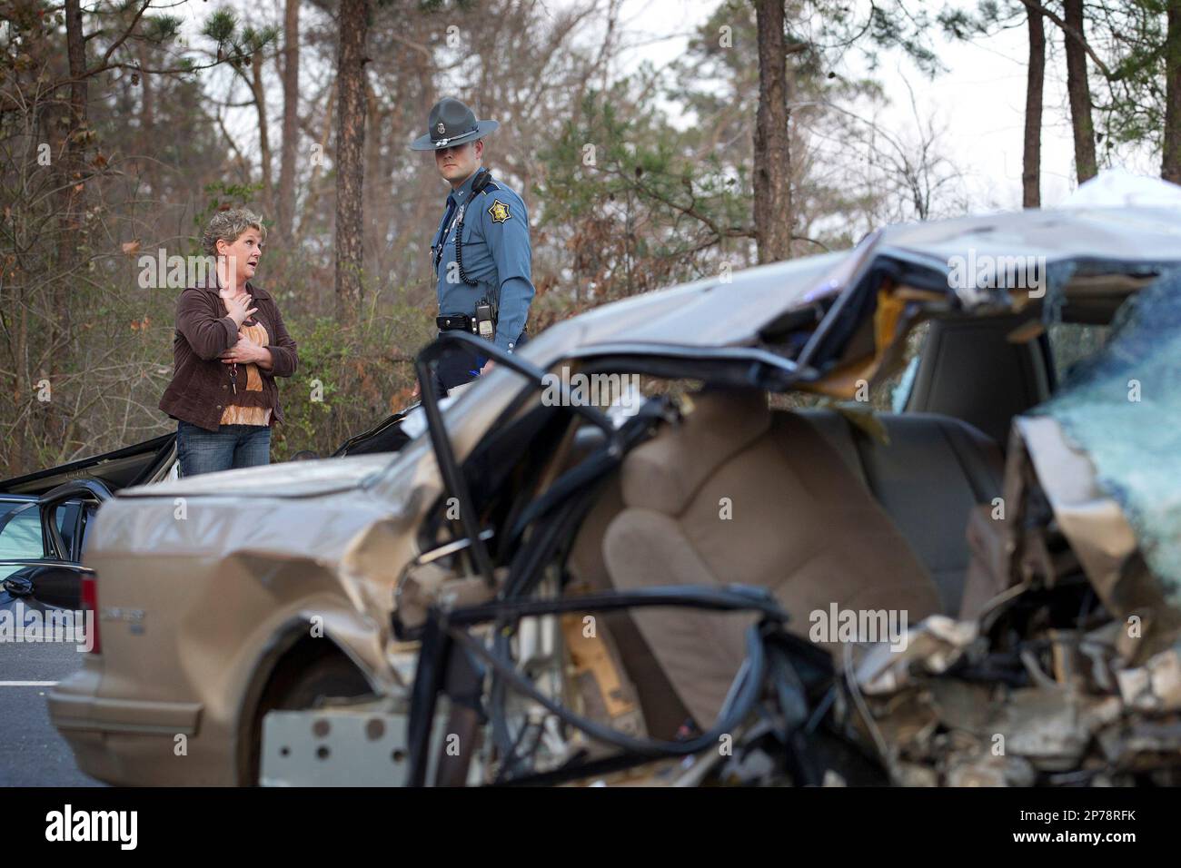 Chris Bussey, Arkansas State Police corporal, speaks to the witness who ...