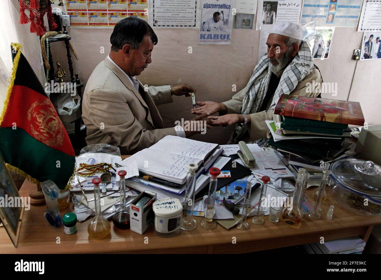 FILE - In this Wednesday, July 14, 2010 picture, Mohammad Sherzad ...