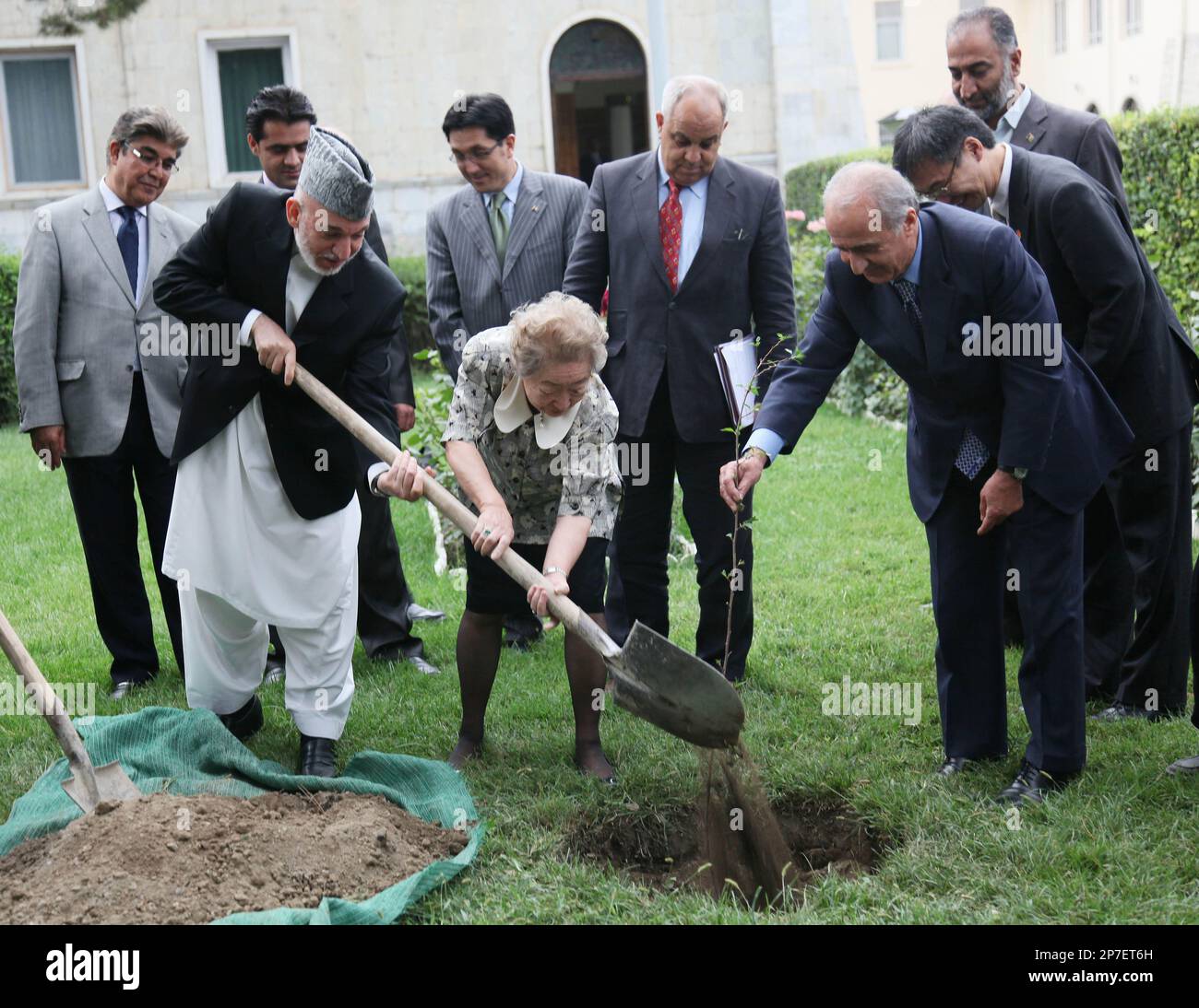Afghanistan's President Hamid Karzai , left and Sadako Ogata , centre ...