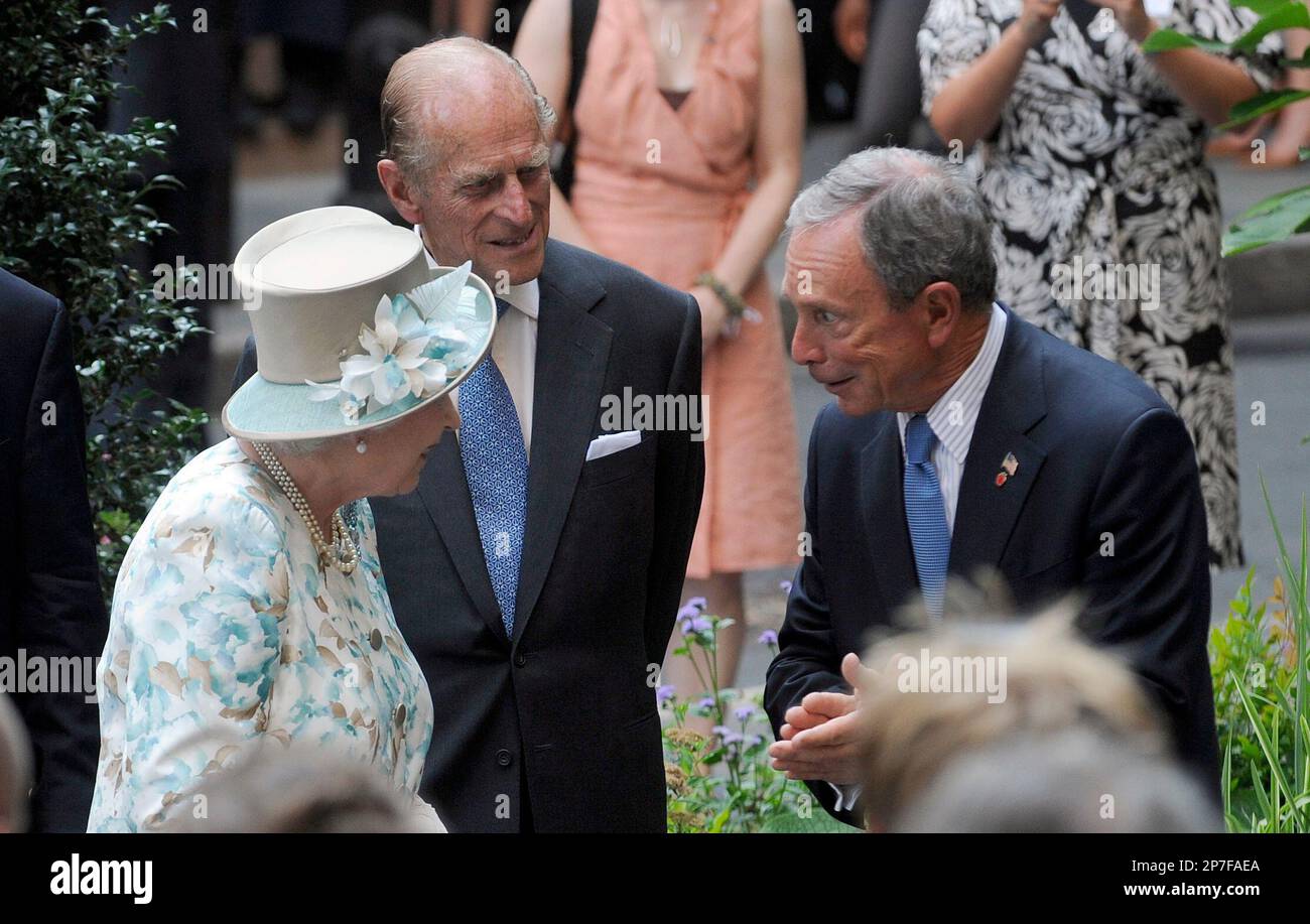 Queen Elizabeth II, left, and Prince Phillip, center, speak to New York ...