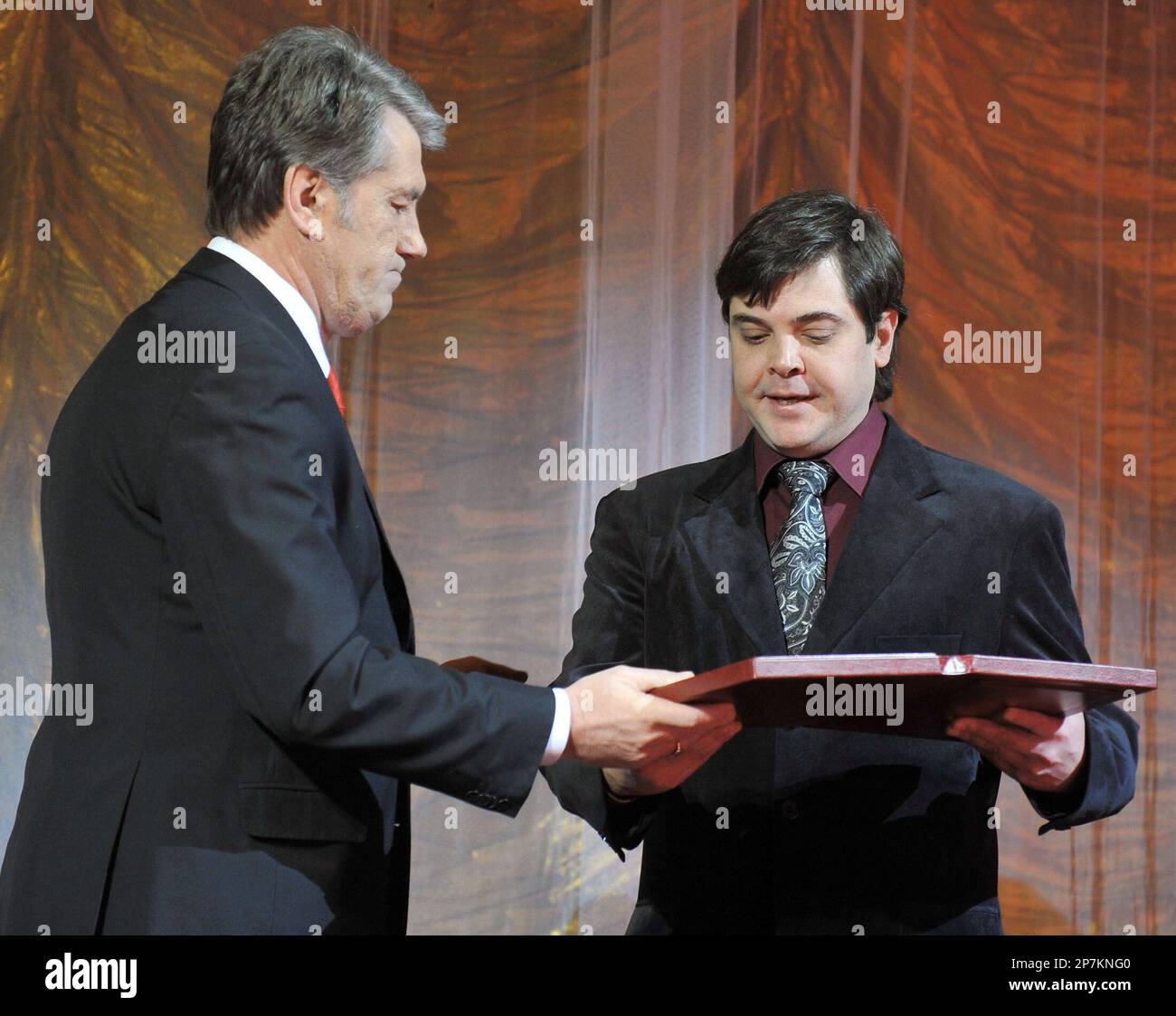 Ukrainian President Viktor Yushchenko, left, gives Stepan Bandera an ...
