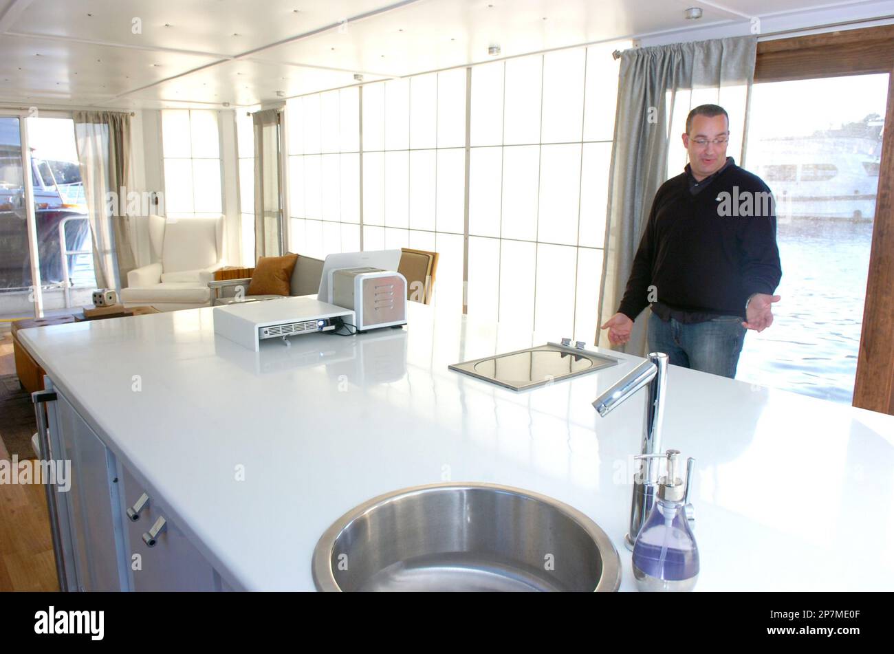 In this photo taken Dec. 10, 2009, David Ballinger stands on board his ...