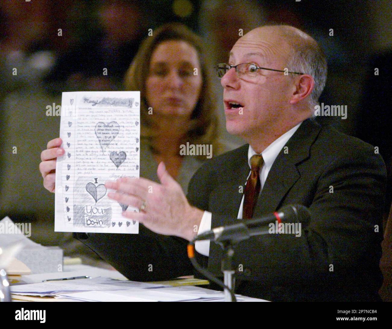 Attorney Barry Dyller shows a letter one of the juvenile victims wrote ...