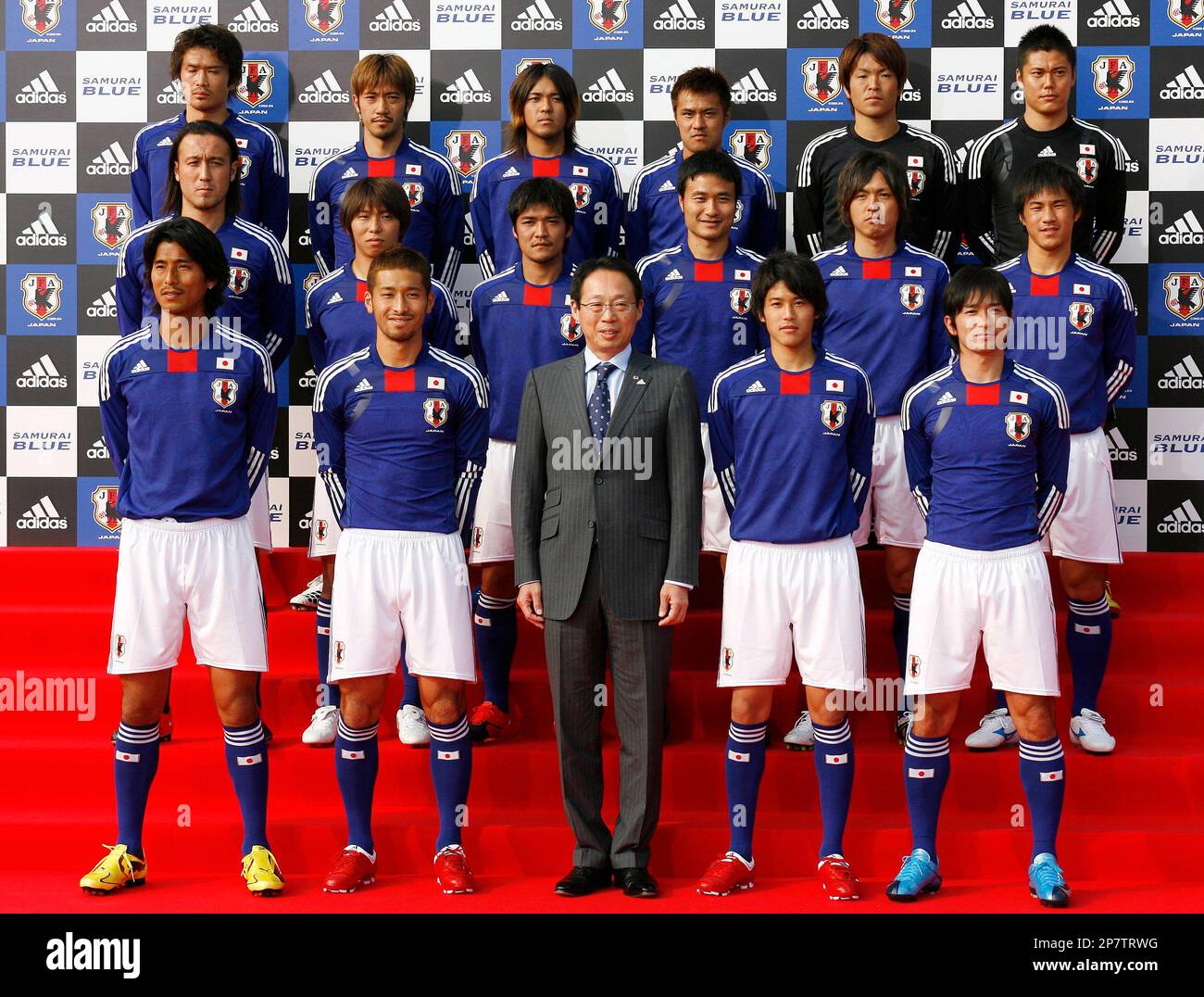 Members of Japan's national soccer team and coach Takeshi Okada ...