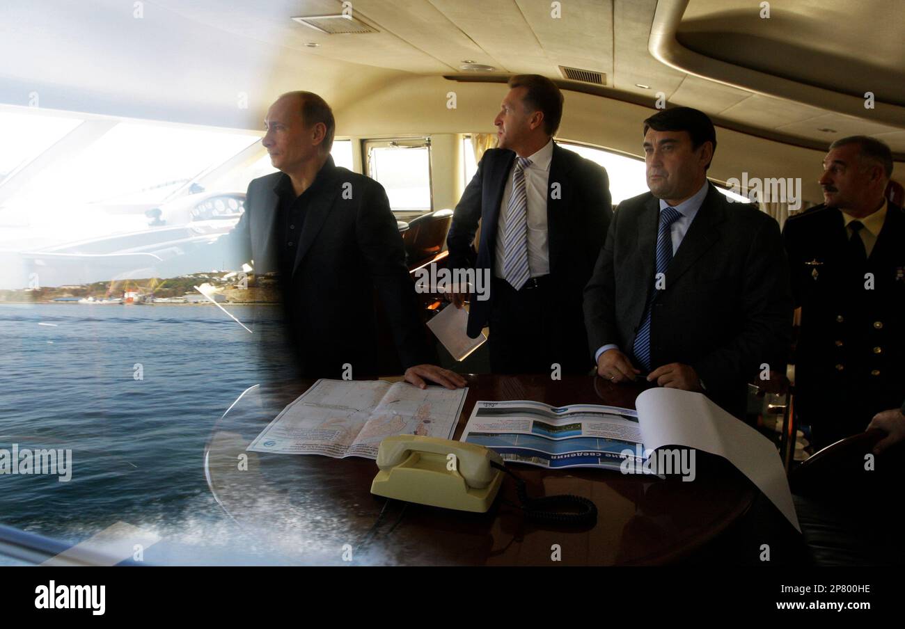In this photo taken through a boat's windshield, Russian Prime Minister ...