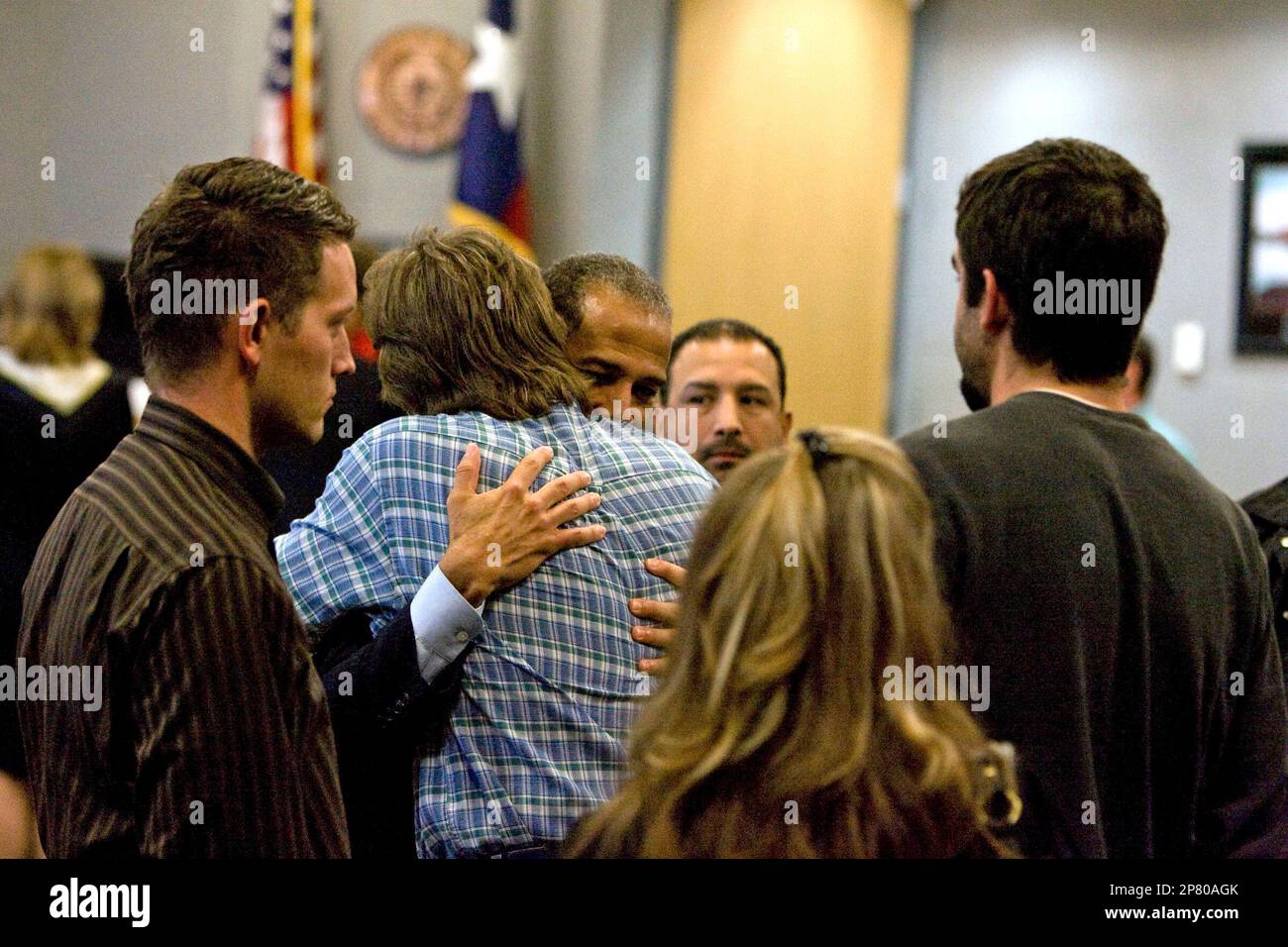 Darryl Gribble, back to camera wearing blue shirt, the step-father of ...