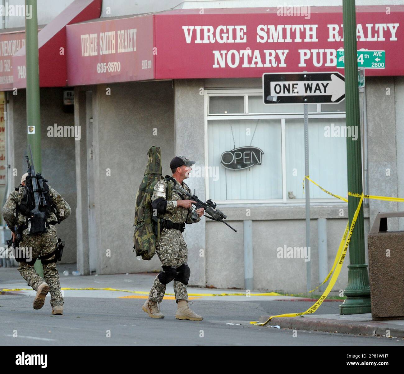 An Alameda County Sheriff's SWAT team member covers an Oakland, Calif ...