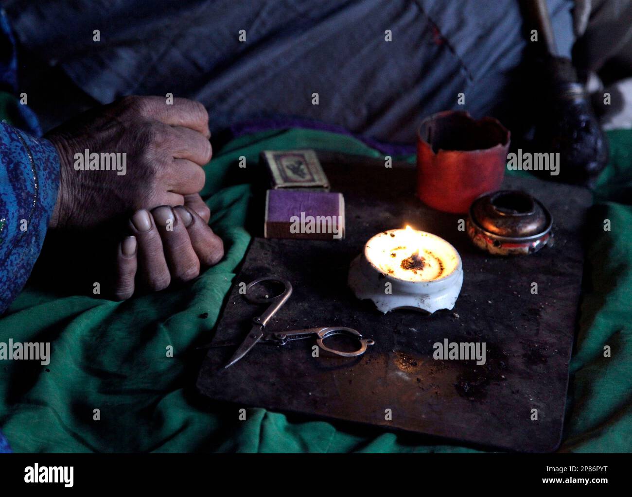 In this July 12, 2009 photo, bits of burnt opium are scattered on a ...