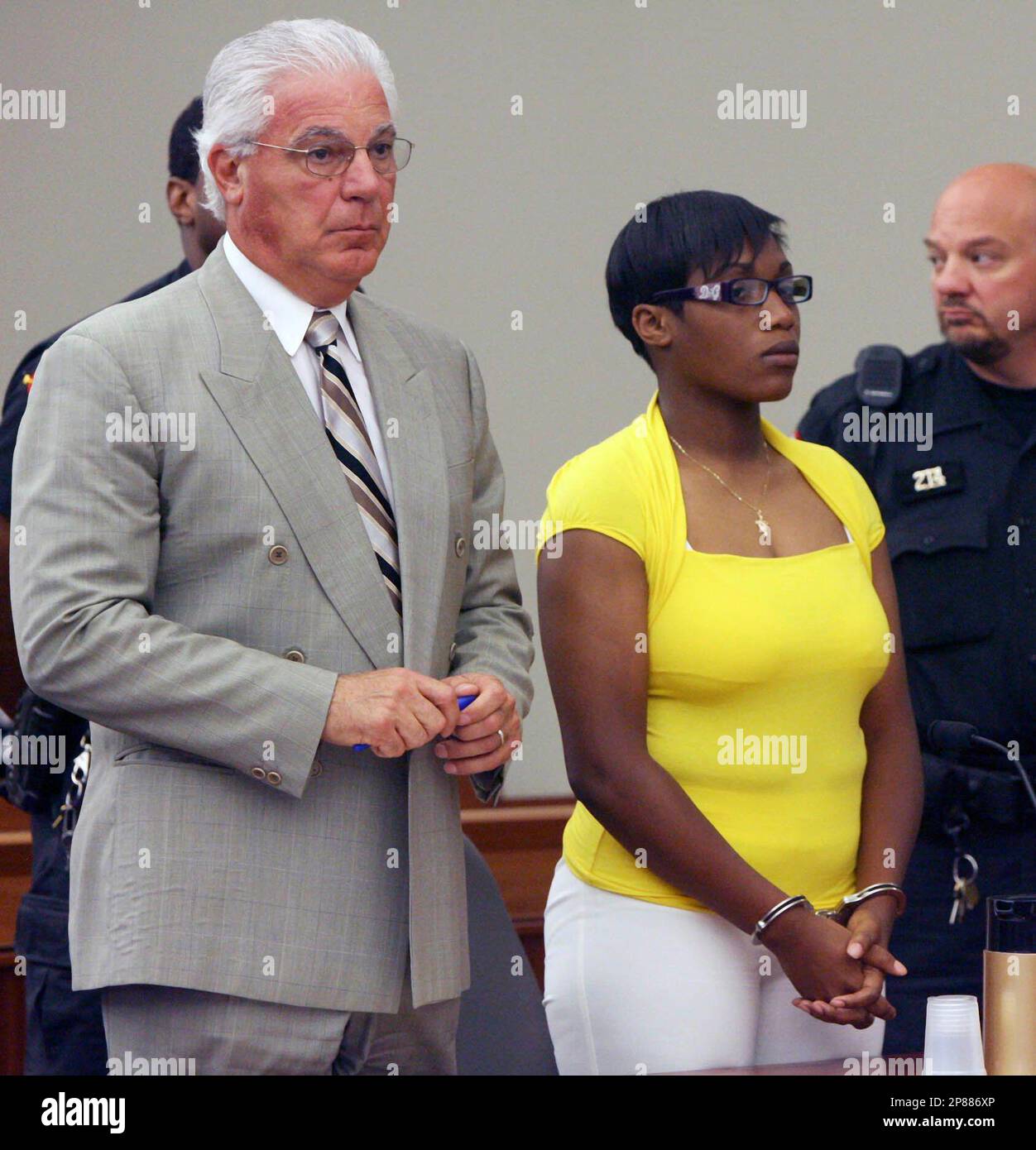 Abimbola Johnson, right, and her attorney John Bevilacqua, left, stand ...